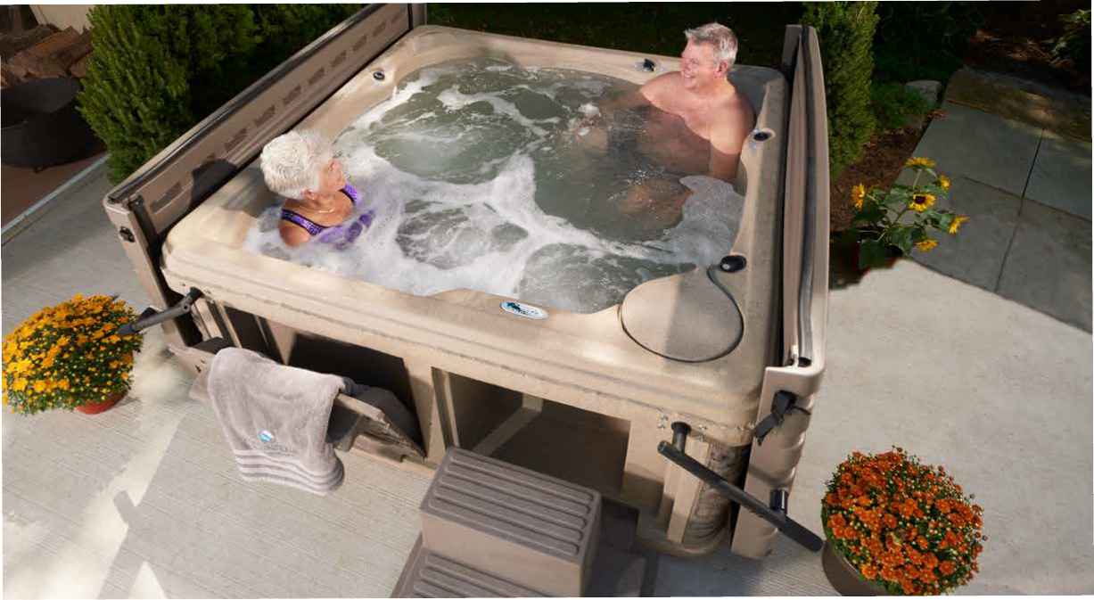 A couple enjoy a massage in their Strong Spa | Custom Spas Direct